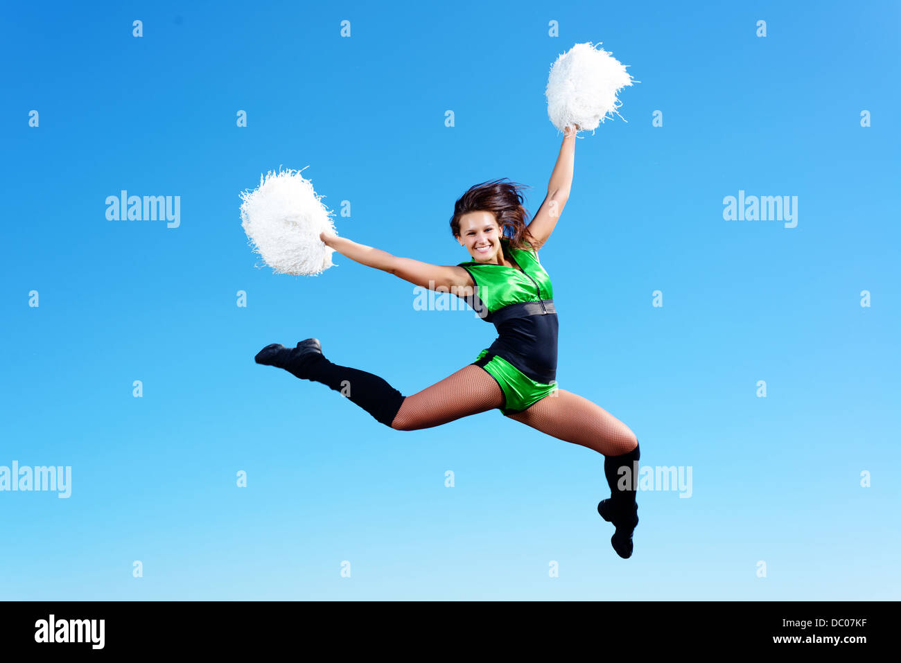 cheerleader girl jumping Stock Photo - Alamy