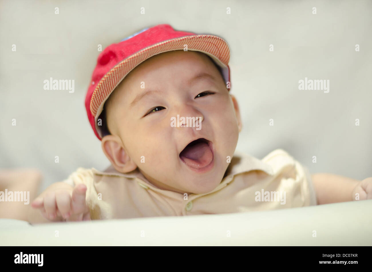 Cute infant smiling Stock Photo - Alamy