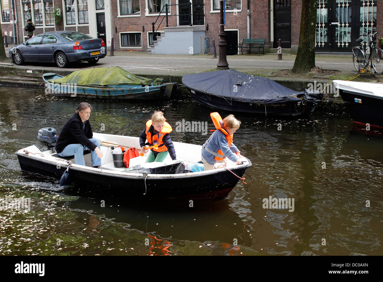 Amsterdam Netherlands Holland Europe small boats along a canal Stock ...