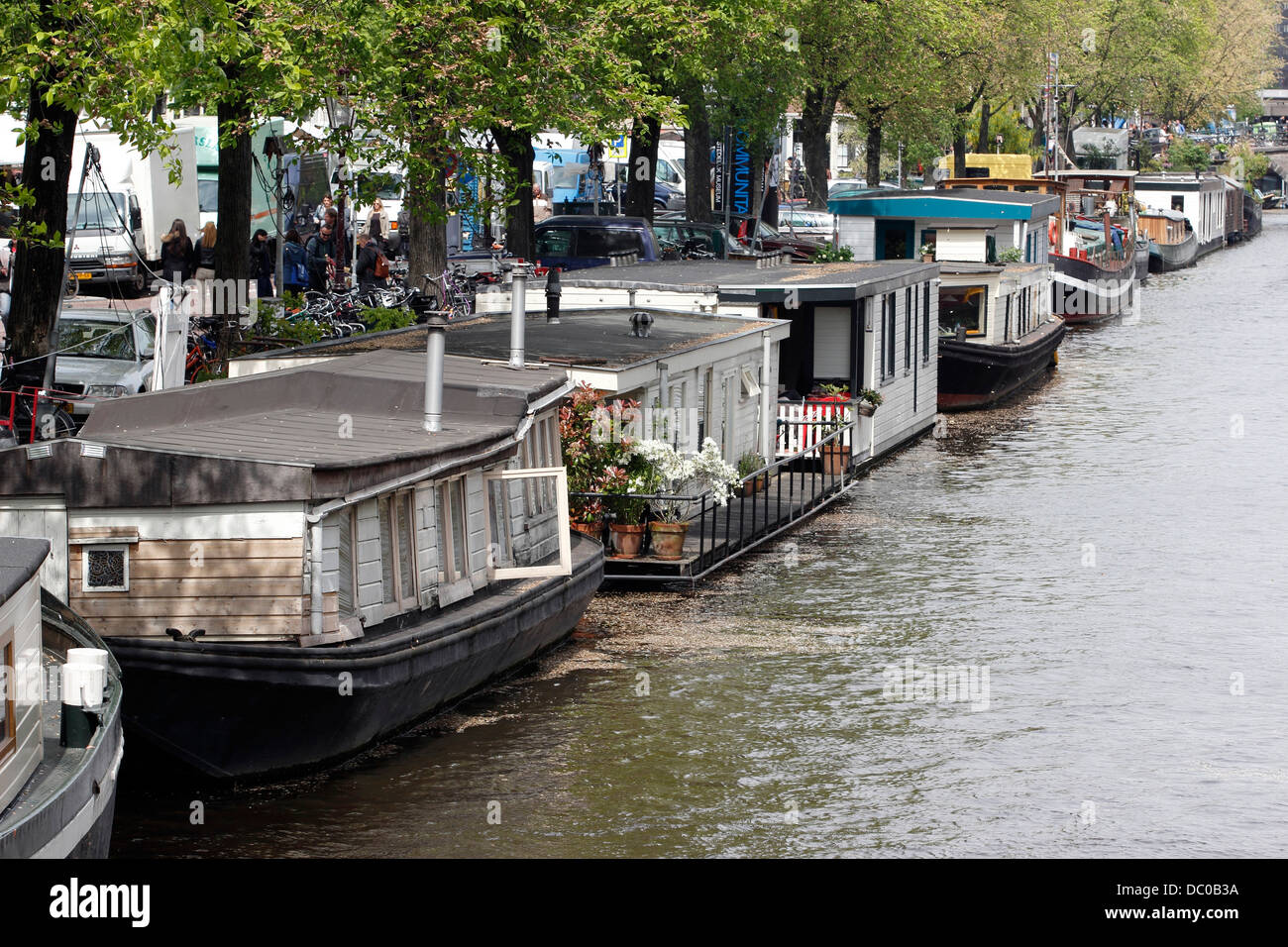 Amsterdam Netherlands Holland Europe small boats houseboats on canal by ...
