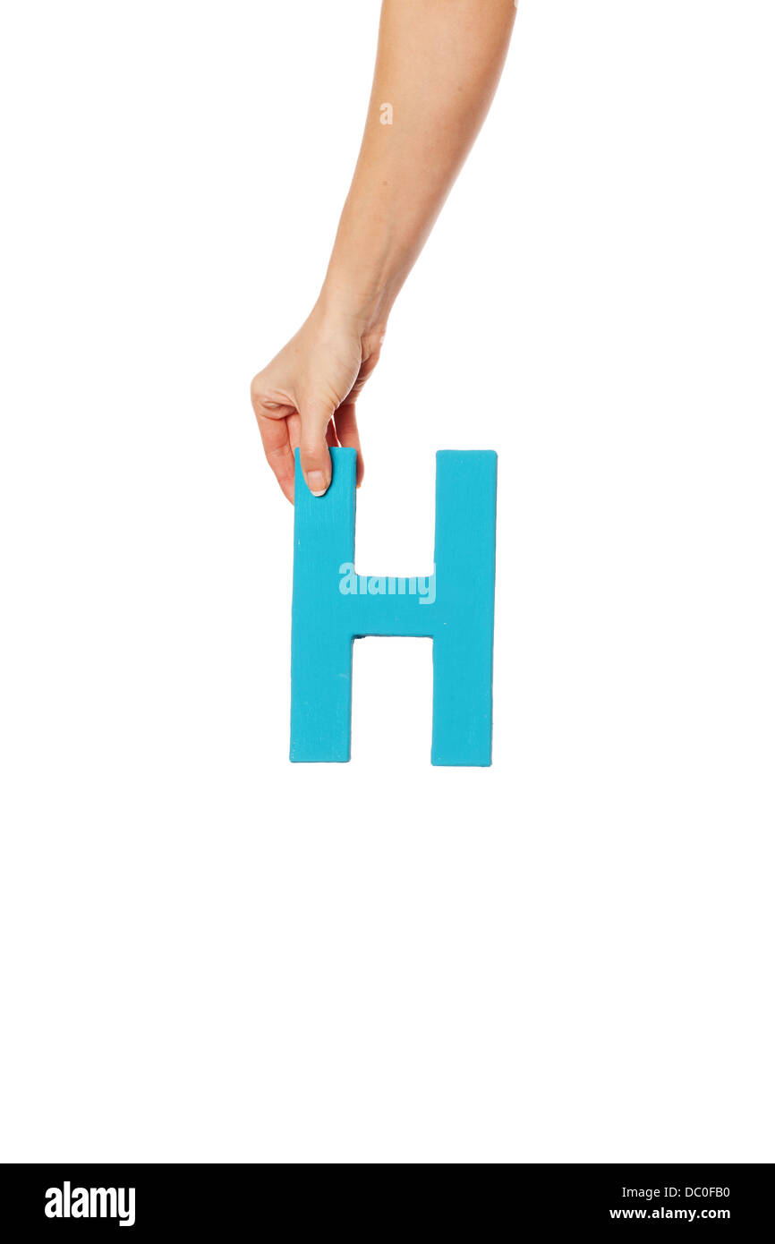 hand holding up the letter H from the top Stock Photo - Alamy