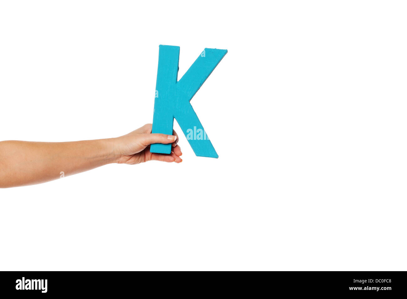 hand holding up the letter K from the left Stock Photo - Alamy