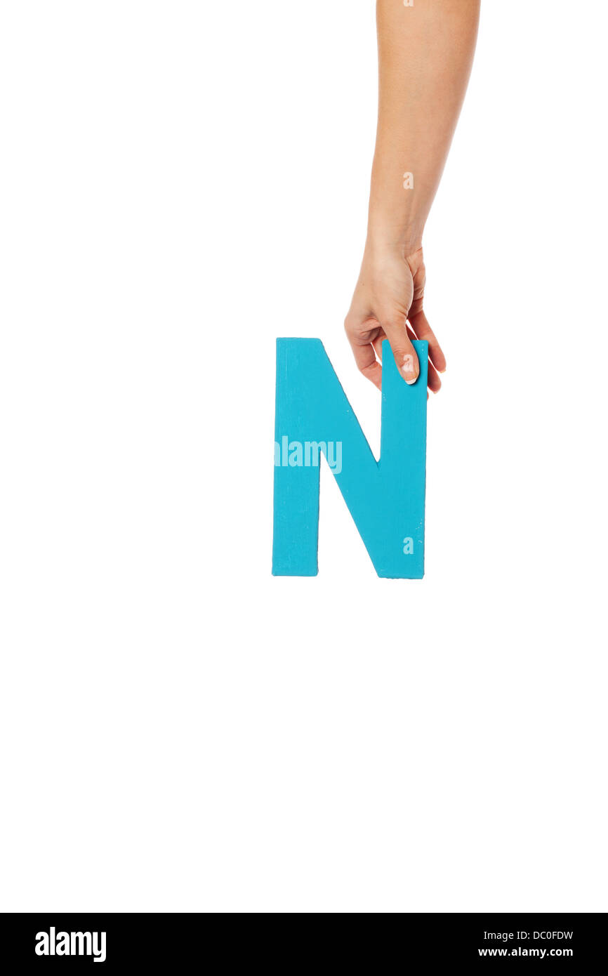 hand holding up the letter N from the top Stock Photo - Alamy