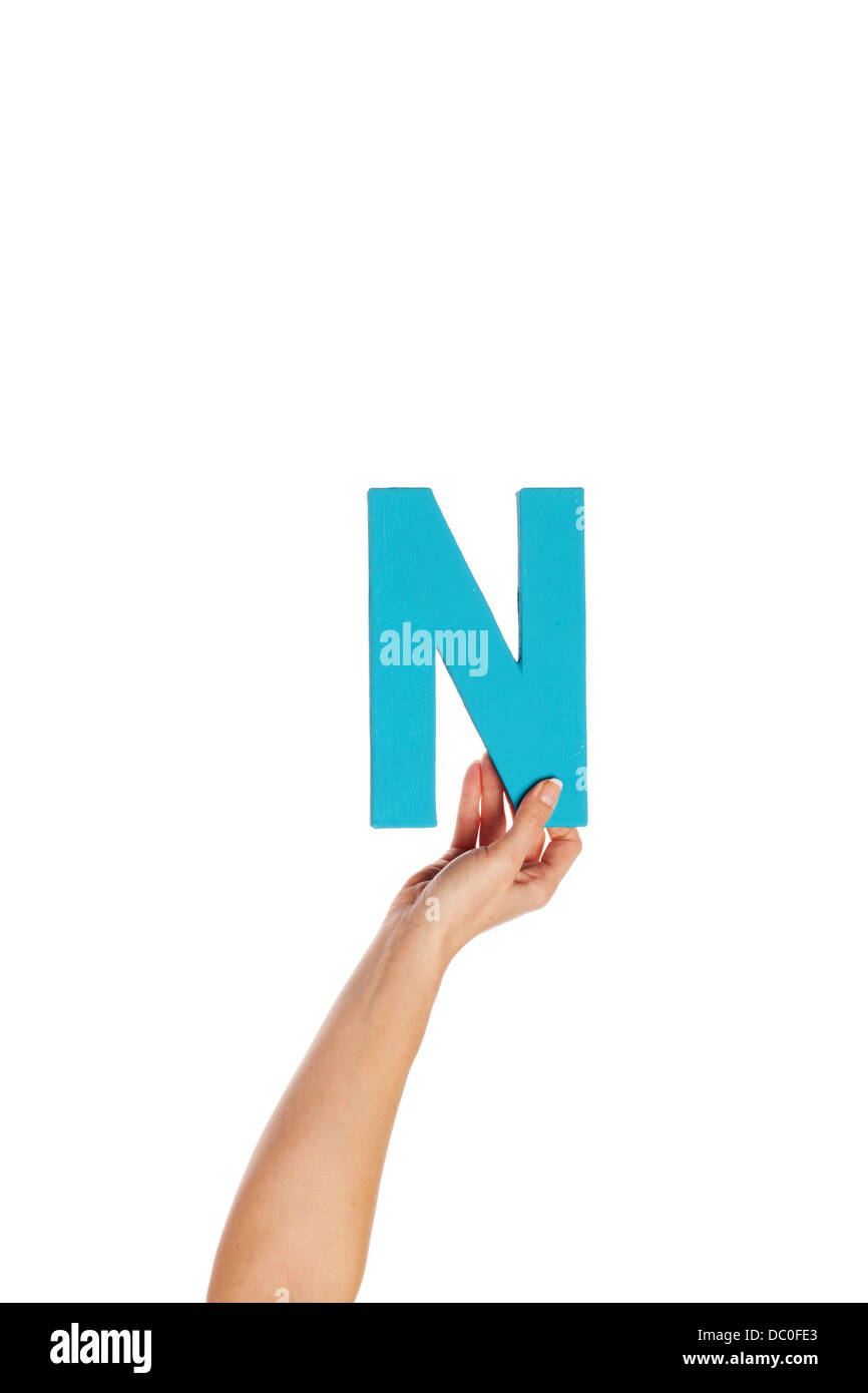hand holding up the letter N from the bottom Stock Photo - Alamy