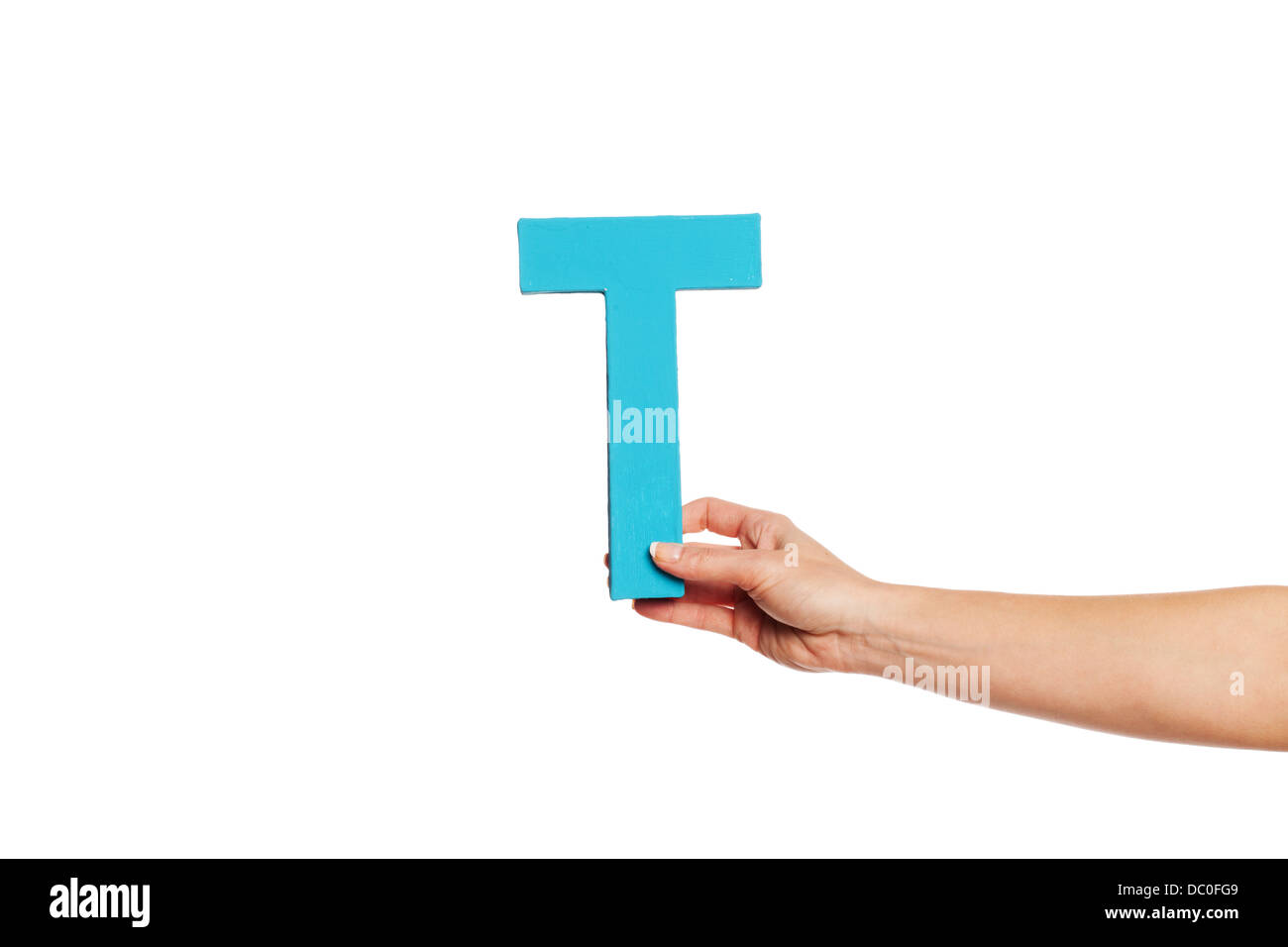 hand holding up the letter T from the right Stock Photo - Alamy