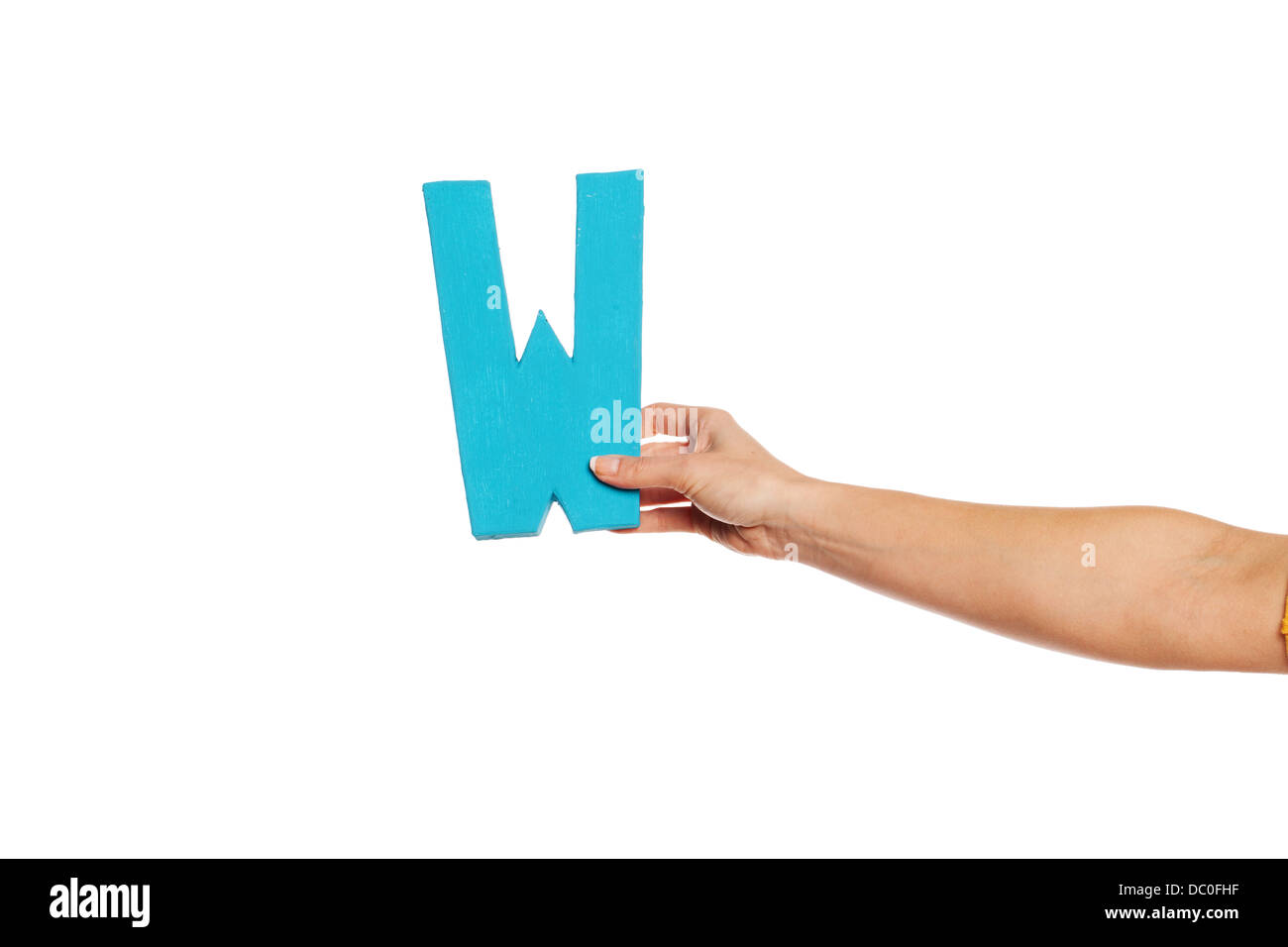 hand holding up the letter W from the right Stock Photo - Alamy