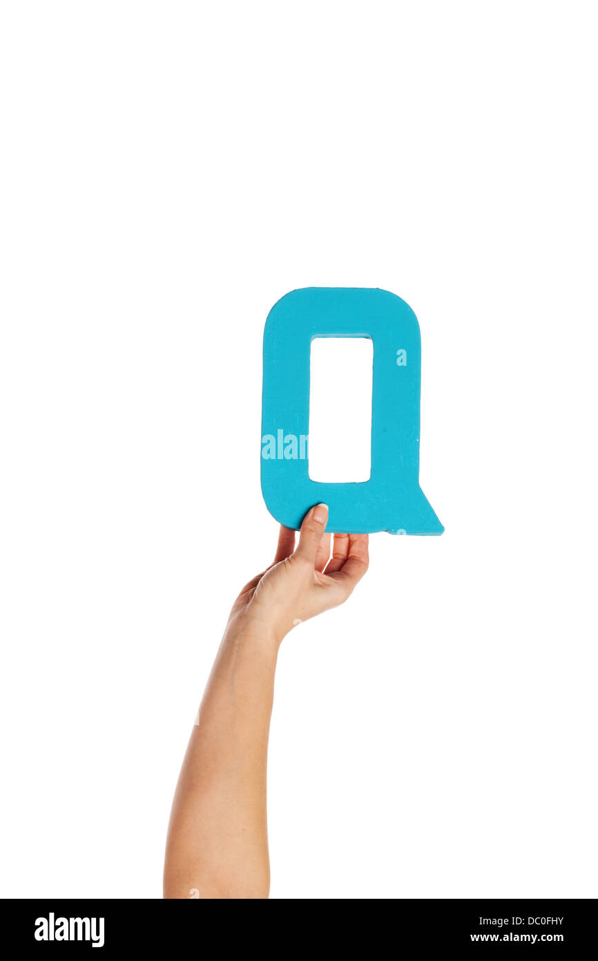hand holding up the letter Q from the bottom Stock Photo - Alamy