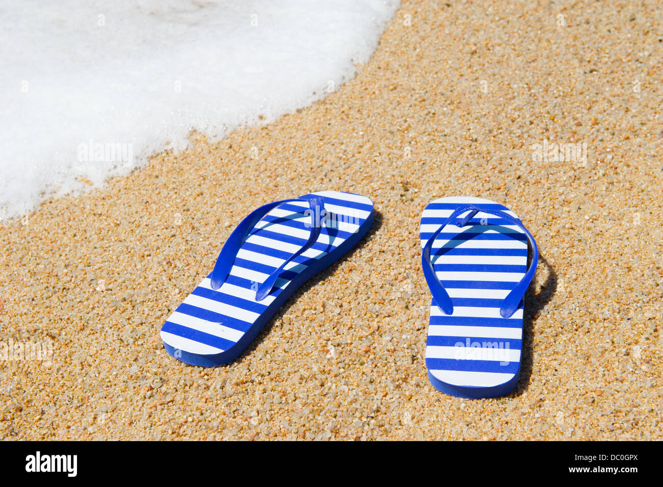Flip flops at the beach Stock Photo - Alamy