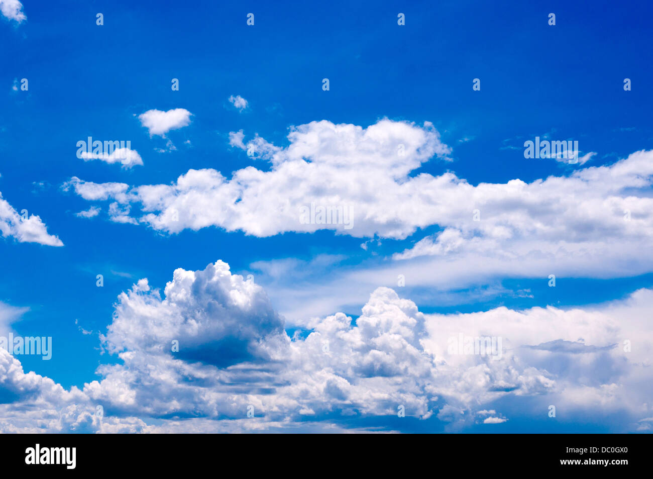 Large group of the fluffy clouds on blue sky Stock Photo - Alamy