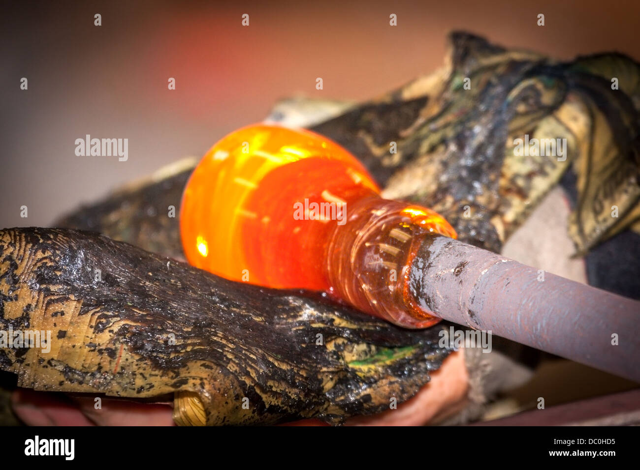 Glassblower molding glass Stock Photo - Alamy