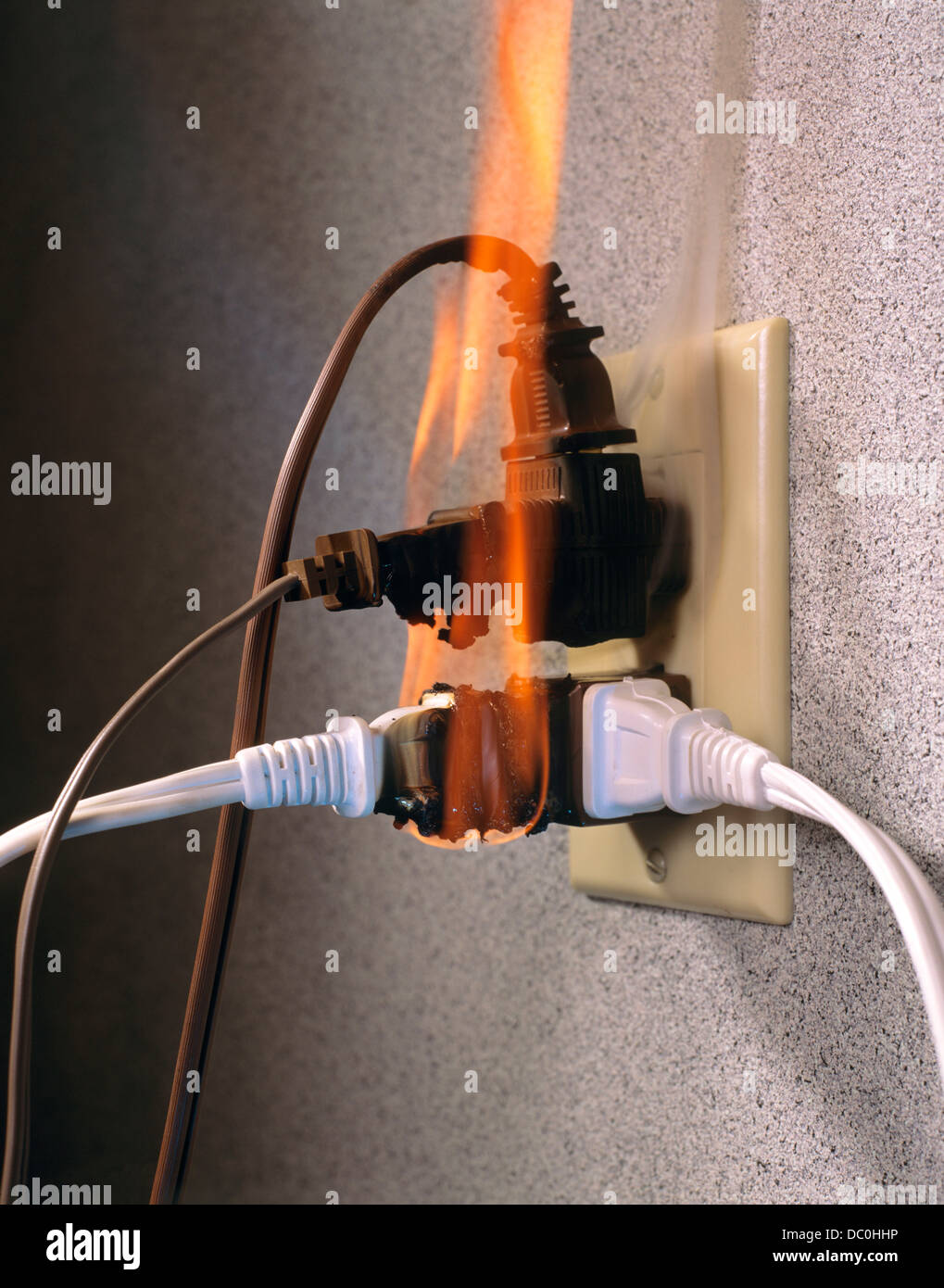 1990s OVERLOADED ELECTRICAL OUTLET BURSTING INTO FLAMES Stock Photo - Alamy