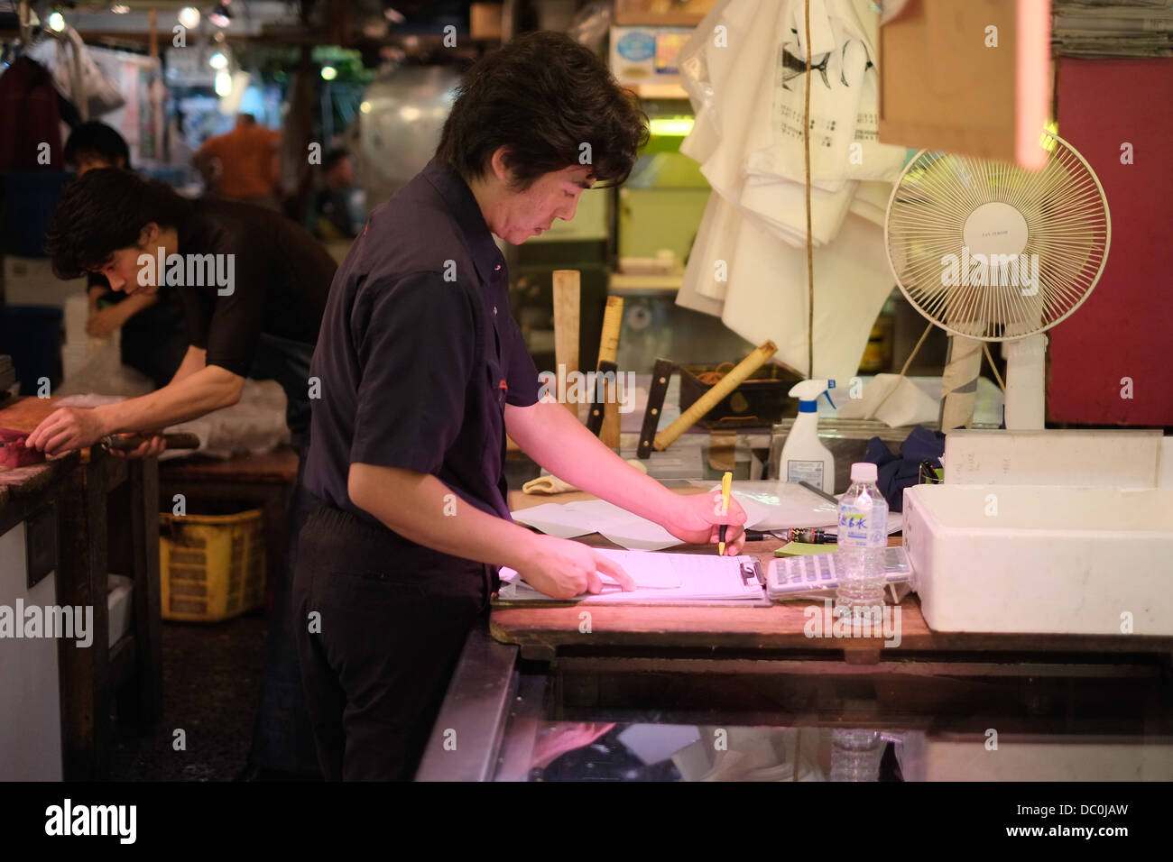 Vendors at Tsukiji fish market, Tokyo Japan Stock Photo - Alamy
