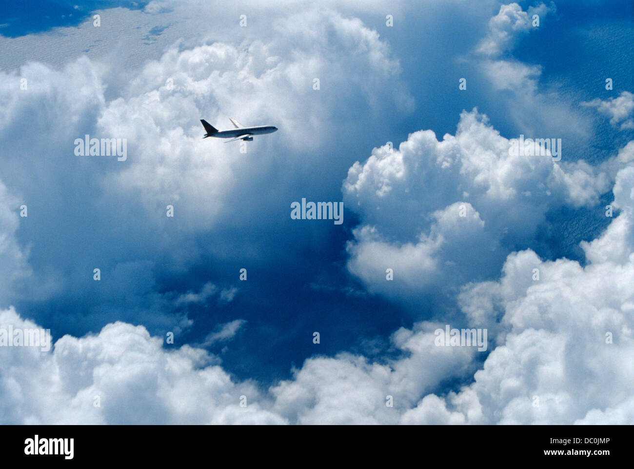 BOEING 767 FLYING THROUGH CLOUDS OVER NORTH ATLANTIC OCEAN Stock Photo ...
