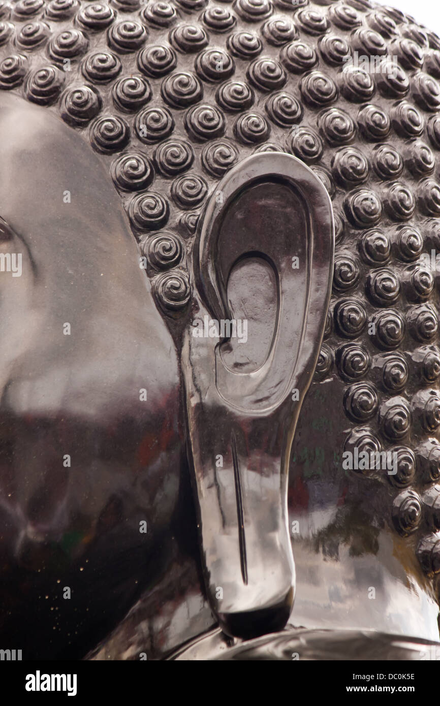 ear of buddha statue in thailand Stock Photo - Alamy