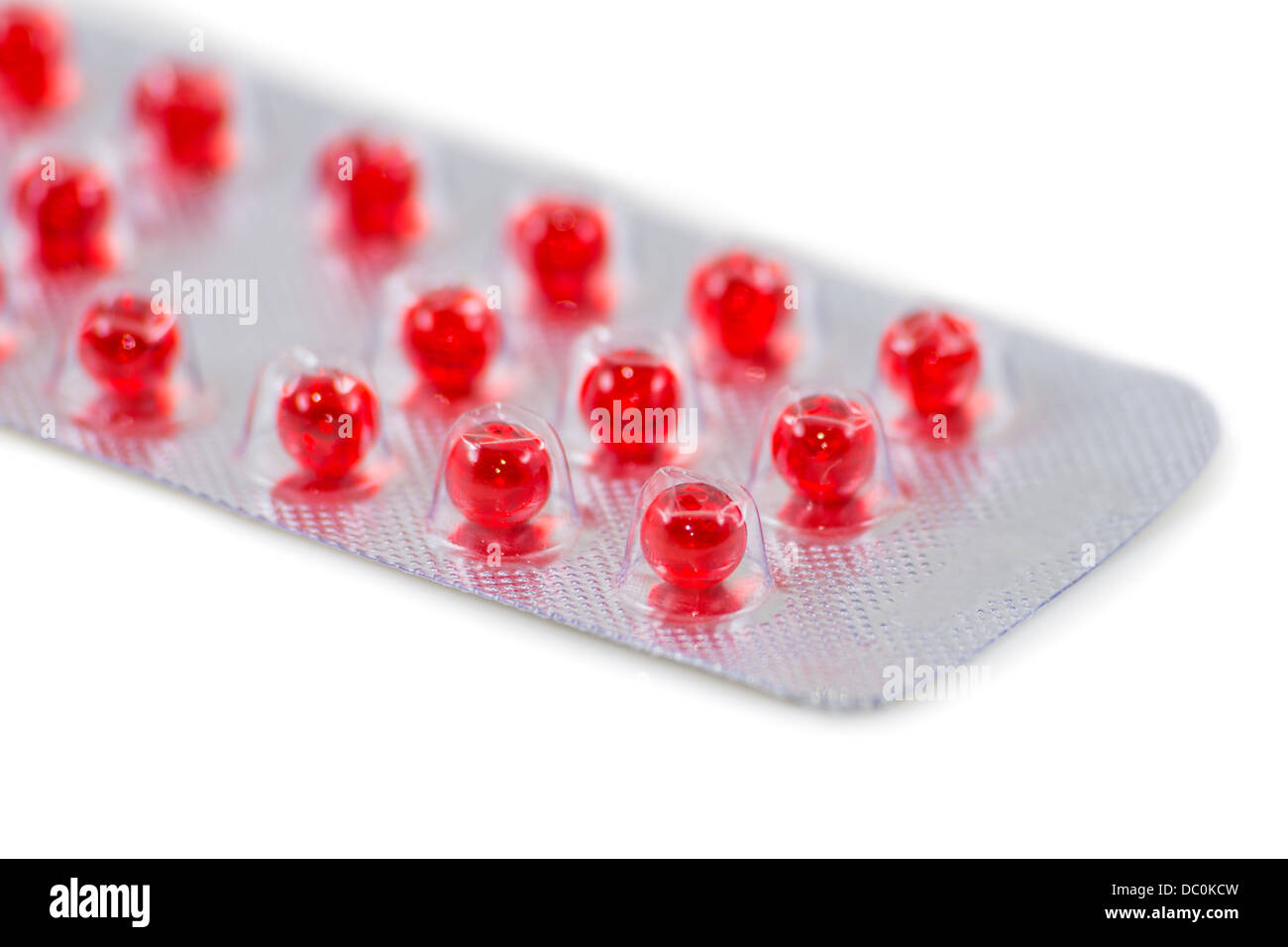 The red pills in a shiny package Stock Photo - Alamy