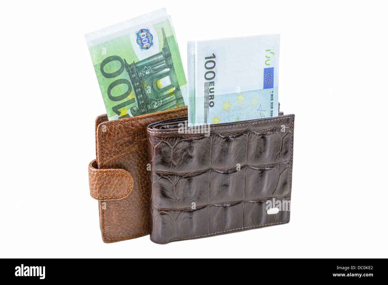The two brown leather wallet with euro is photographed on the close-up ...
