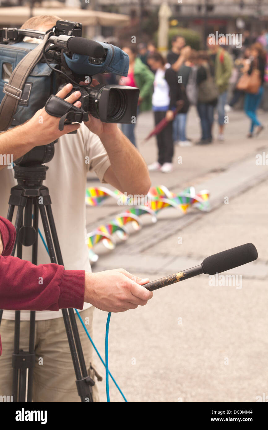 A journalist is making a interview with a microphone Stock Photo - Alamy