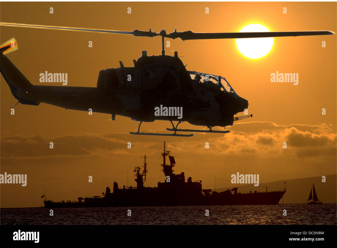 USMC AH-1 SEA COBRA HELICOPTER FLYING AT SUNSET Stock Photo - Alamy