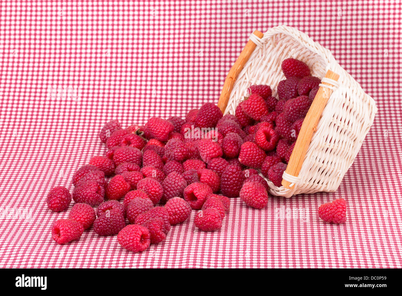 fresh red raspberry with leafs in basket tasty food background Stock ...