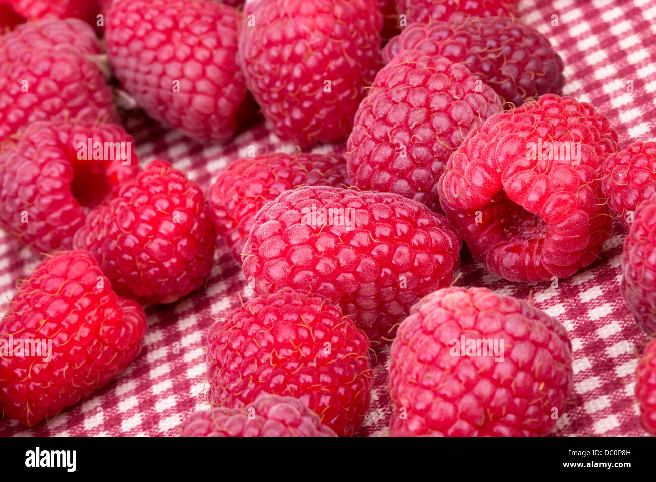 fresh red raspberries a tasty food background Stock Photo - Alamy