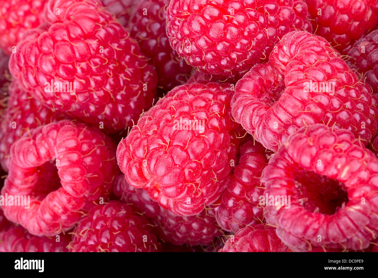 fresh red raspberries a tasty food background Stock Photo - Alamy