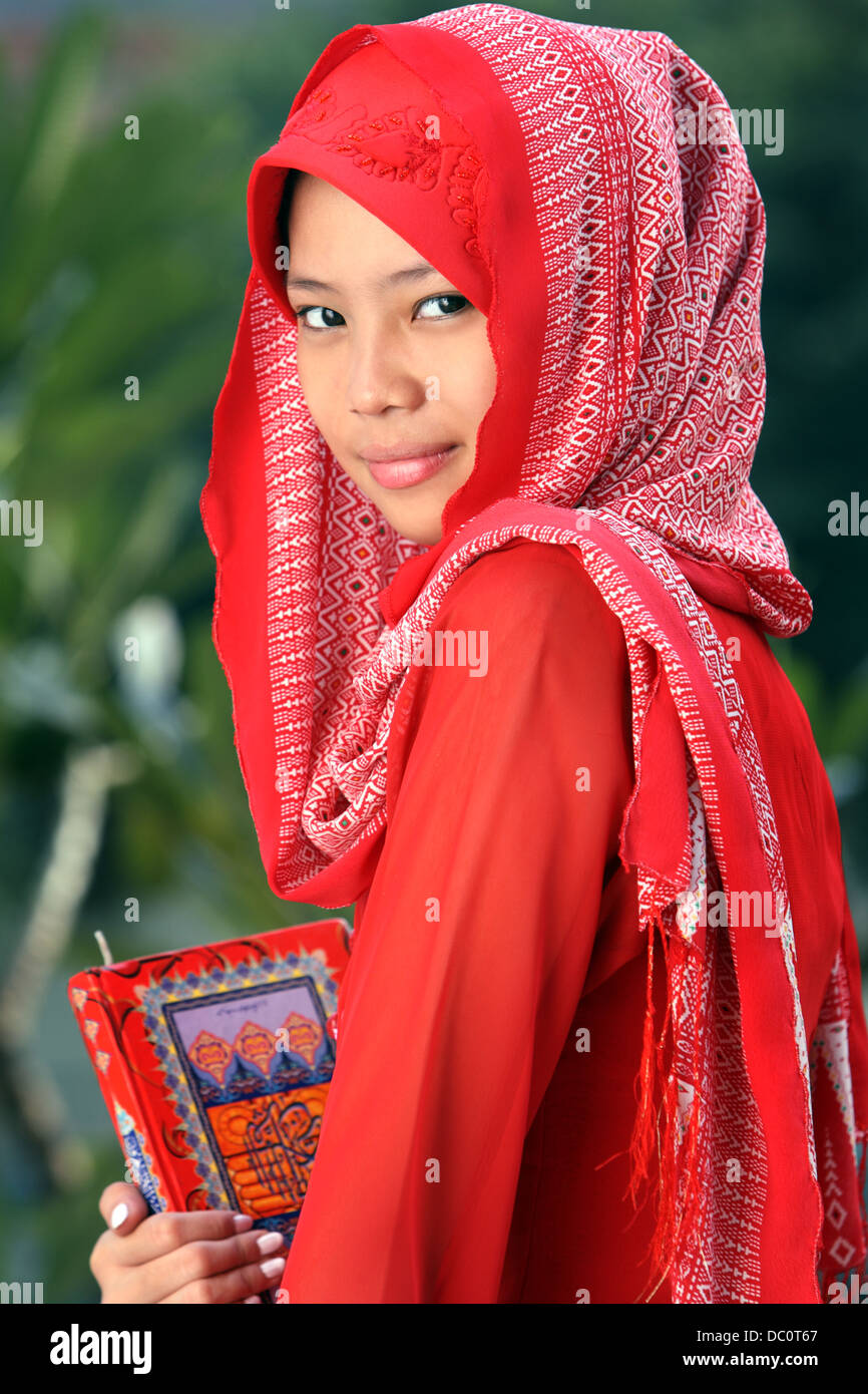 Muslim Girl in a red outfit Stock Photo - Alamy