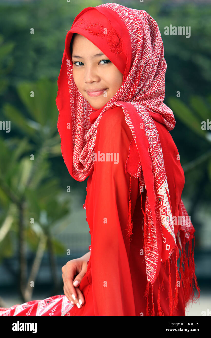 Muslim Girl in a red outfit Stock Photo - Alamy