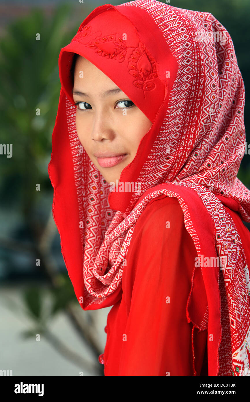 Muslim Girl in a red outfit Stock Photo - Alamy