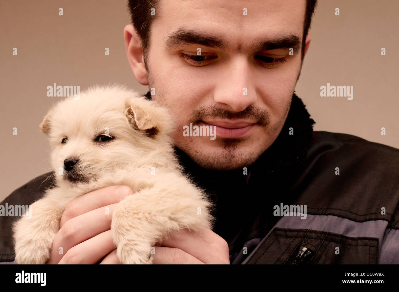 Handsome young man pet hi-res stock photography and images - Alamy