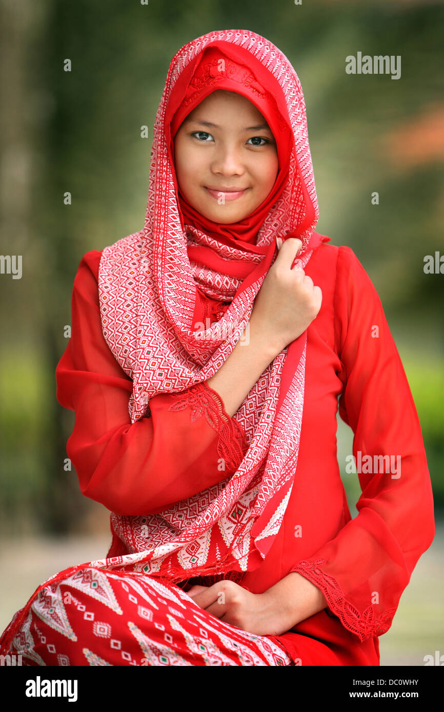Muslim Girl in a red outfit Stock Photo - Alamy