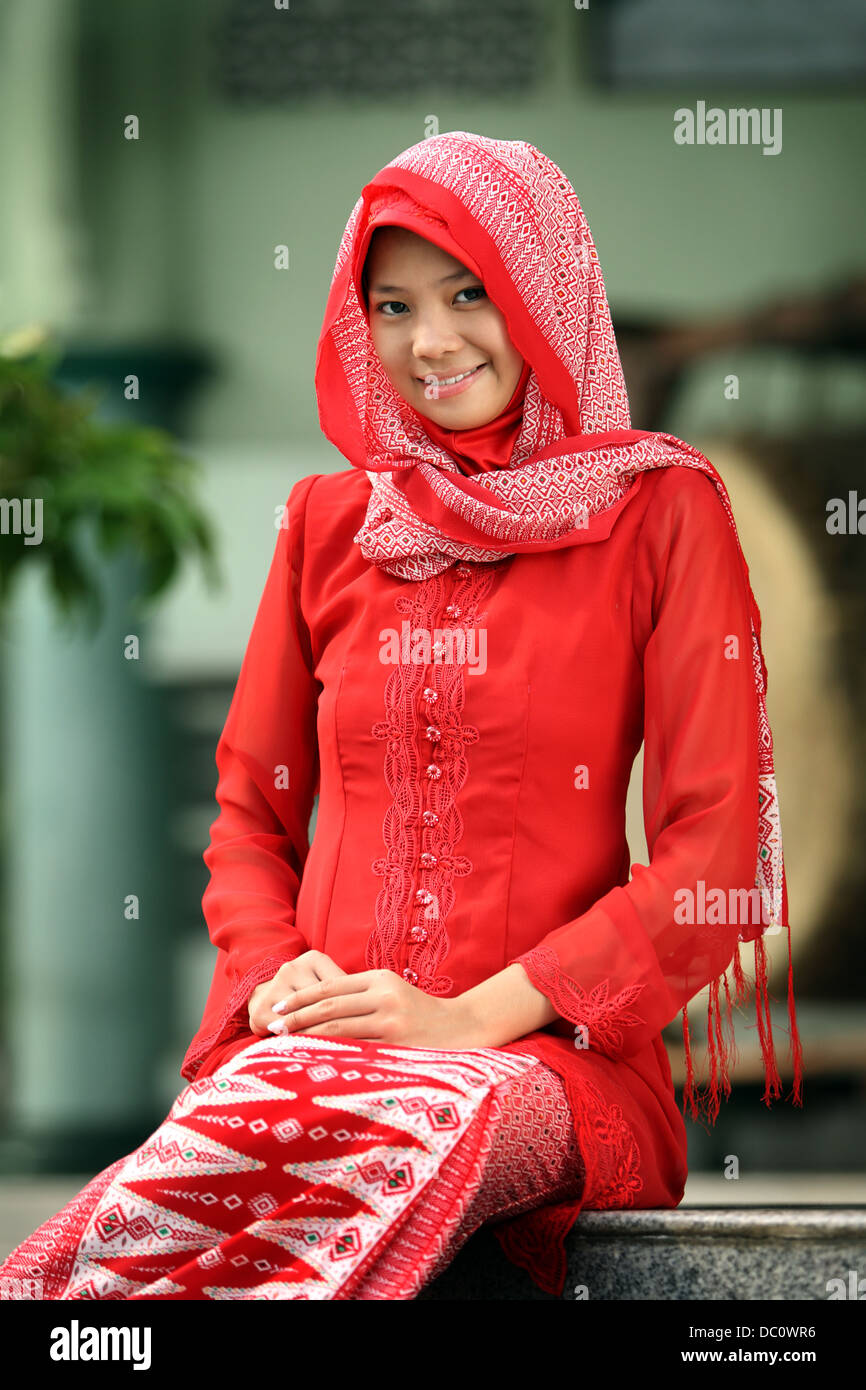 Muslim Girl in a red outfit Stock Photo - Alamy