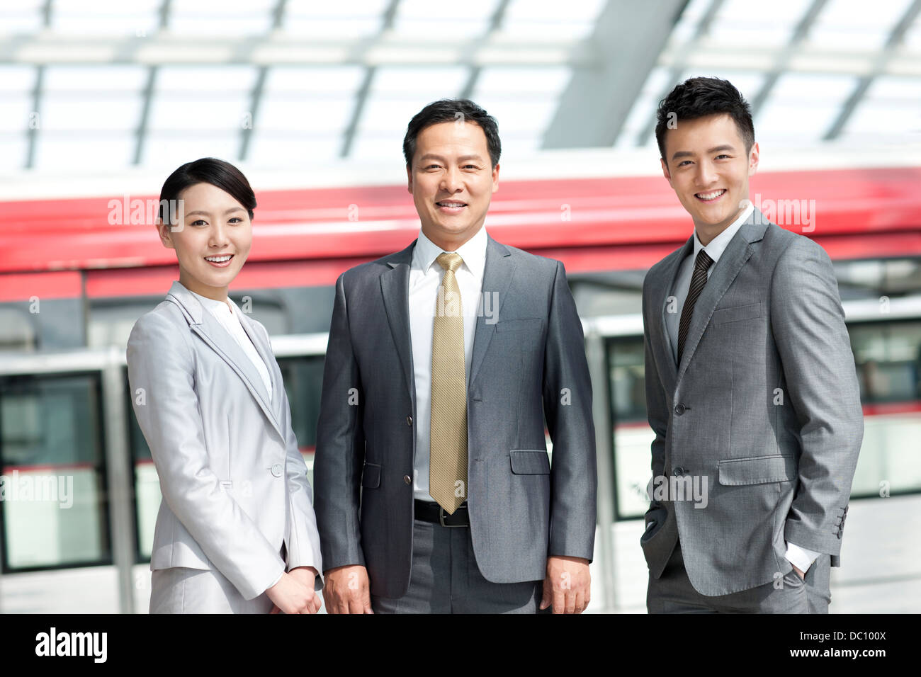 Confident business team at subway station Stock Photo - Alamy