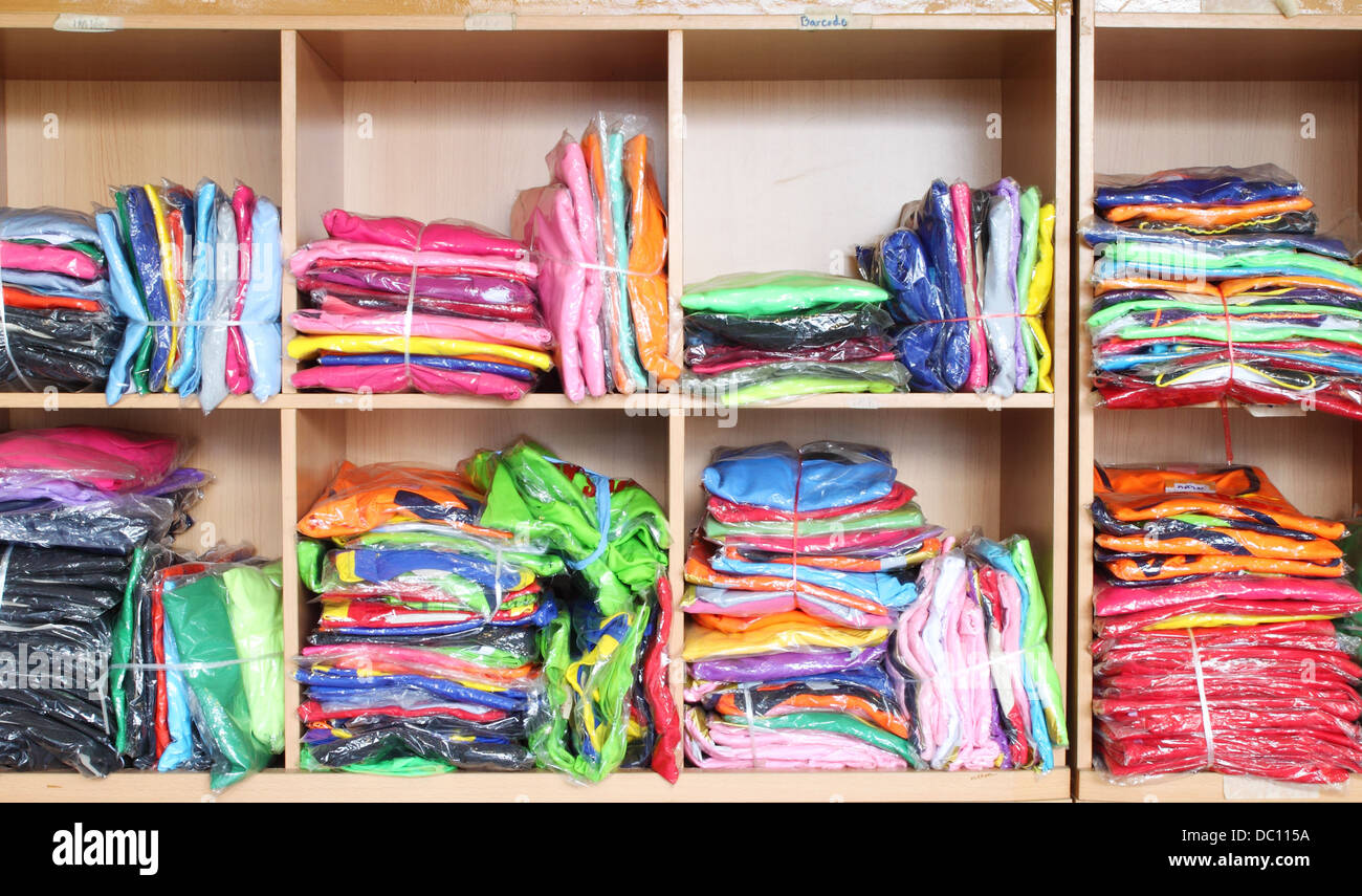 stack of sport clothing on a rack Stock Photo - Alamy