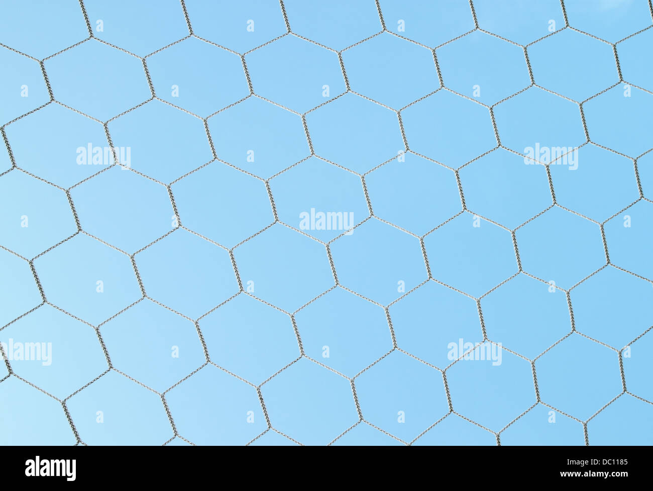 White net football, soccer with blue sky background Stock Photo - Alamy