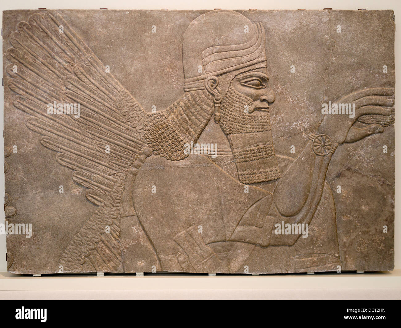 Fragment of a Winged Deity. Neo-Assyrian, from Kalah, Iraq. Gray ...