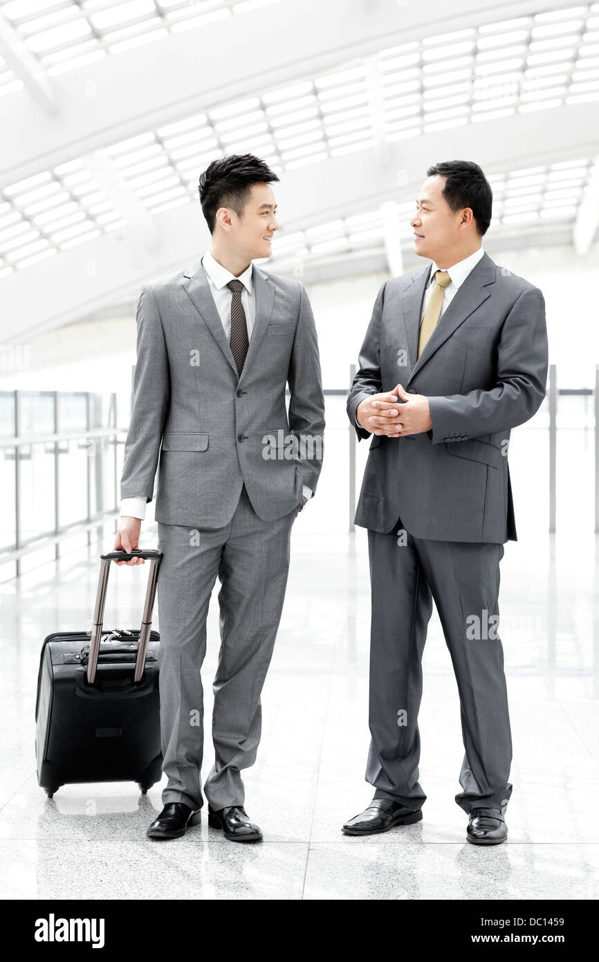 Two business men having conversation together Stock Photo - Alamy