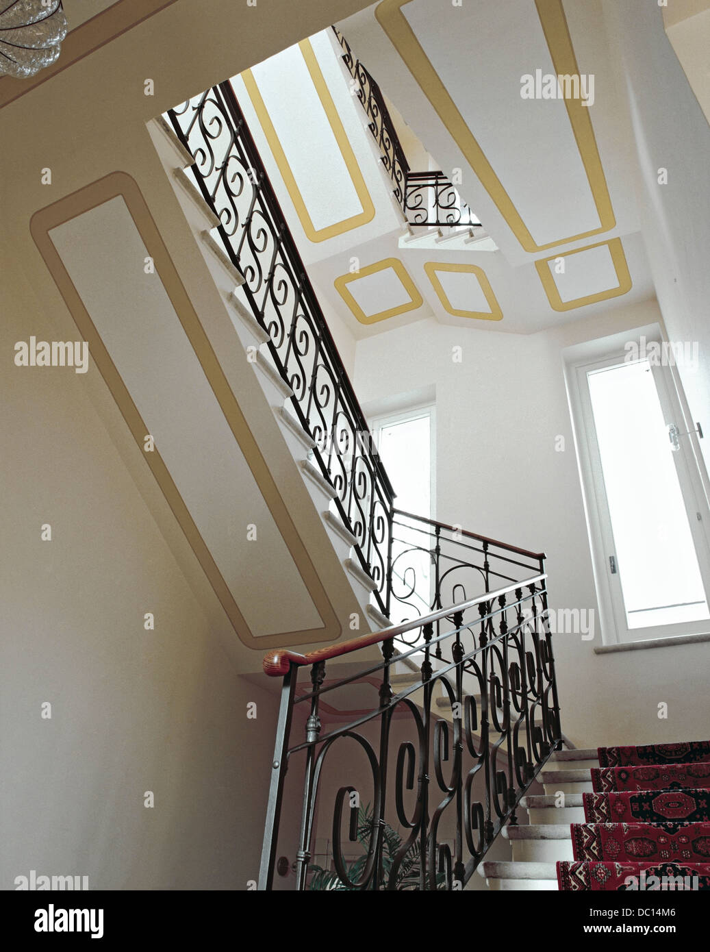 classic staircase with banisters of wrought iron Stock Photo - Alamy