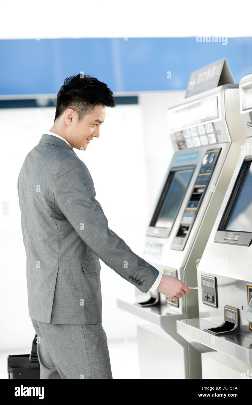 Person using train ticket machine hi-res stock photography and images ...