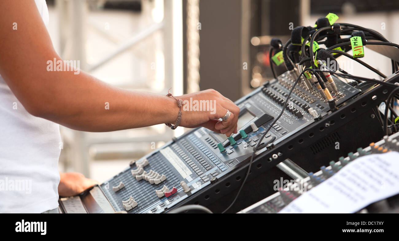 hand over music mixer Stock Photo - Alamy