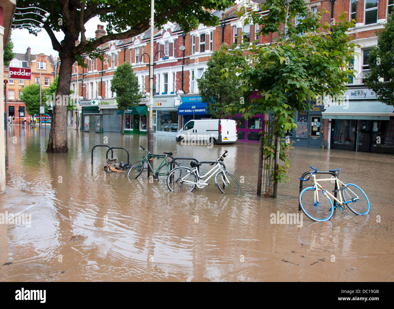 London, UK. 7th Aug, 2013. Half Moon Lane becomes a lake following the ...