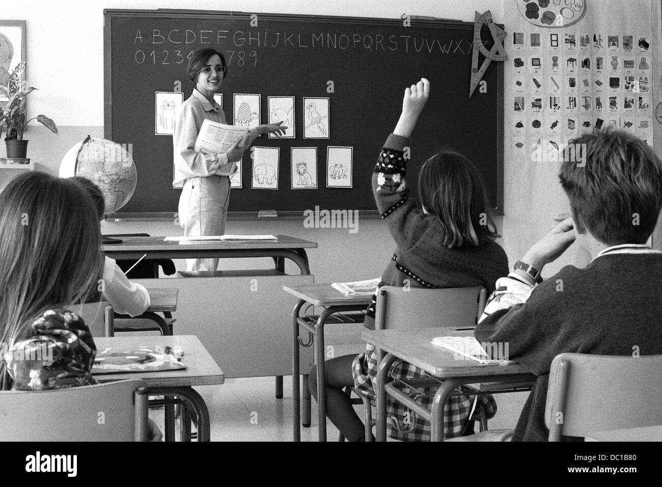 Boy and girl talking classroom Black and White Stock Photos & Images ...