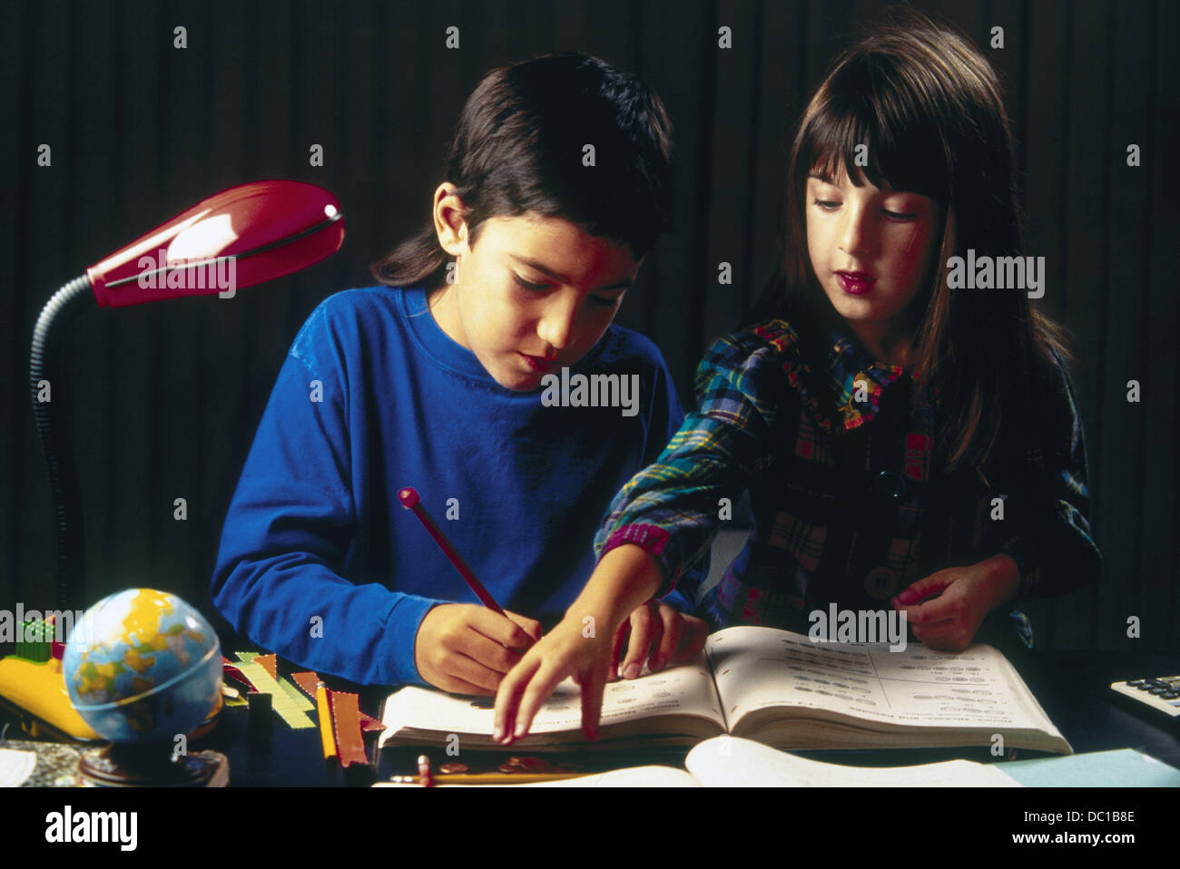 Kid help sibling homework hi-res stock photography and images - Alamy