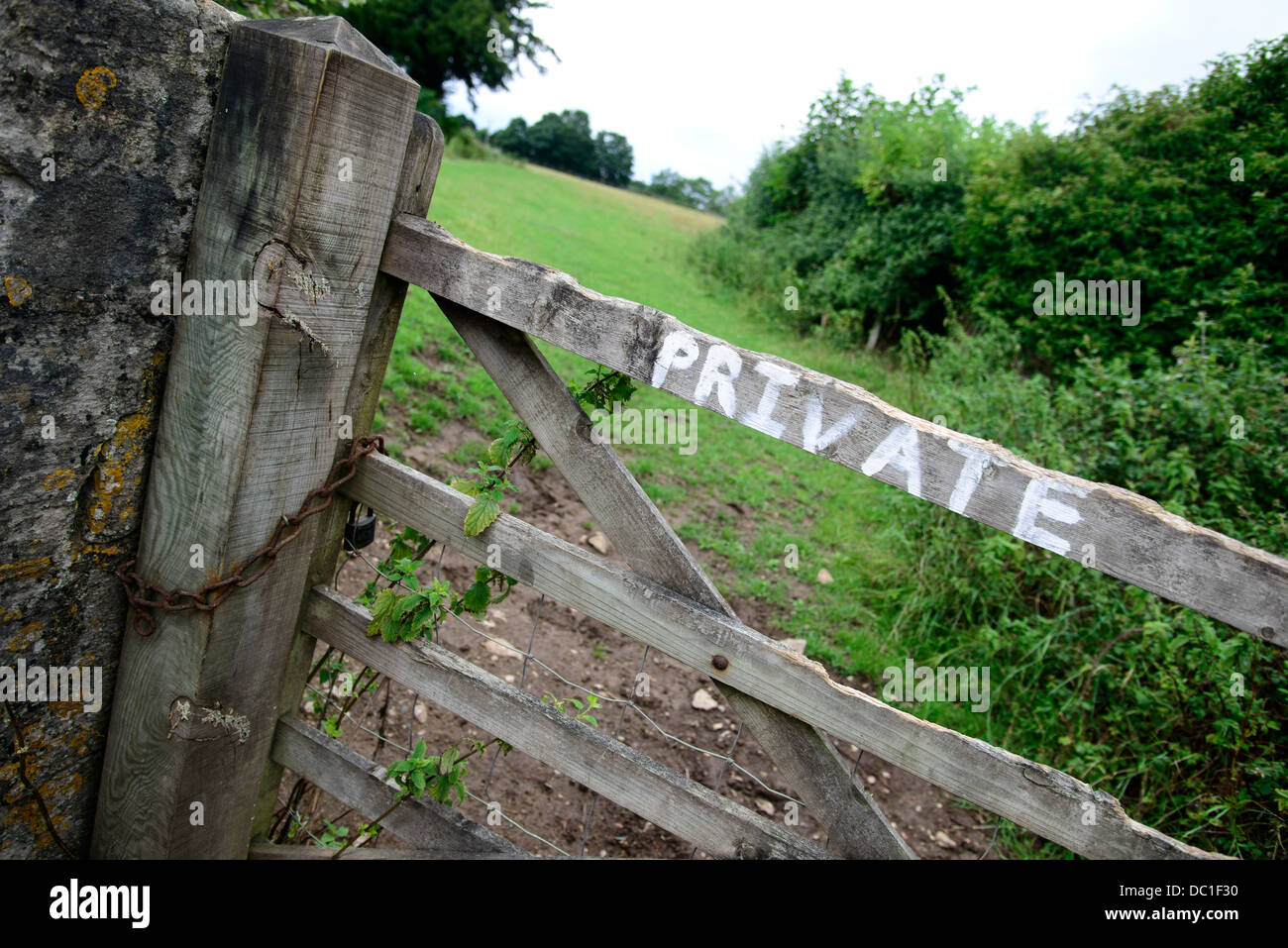 A locked gate with the word 'Private' painted on it. This gate is in ...
