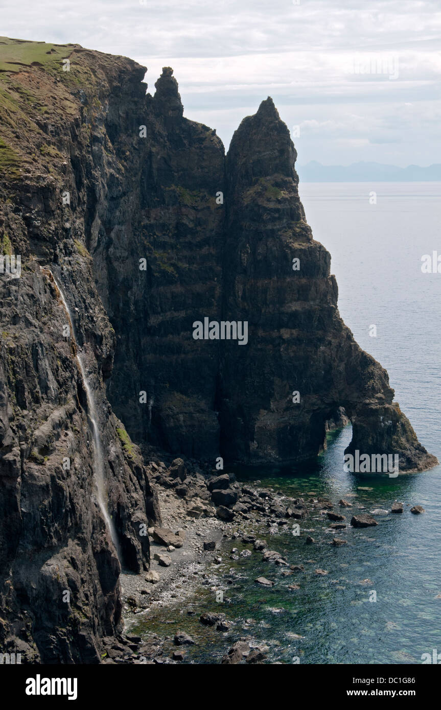 Waterfall, rock arch and cliff scenery on the Duirinish coast, Isle of ...