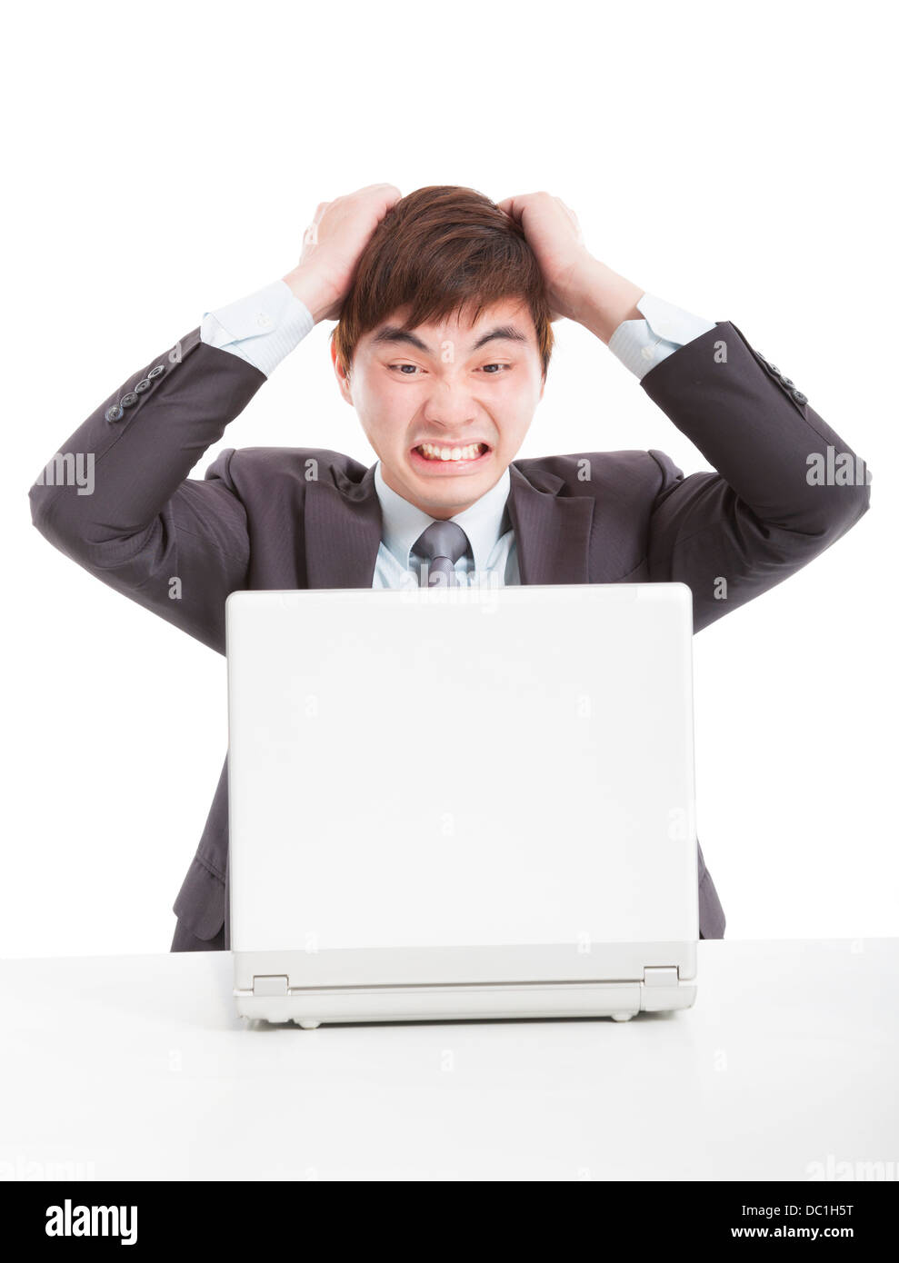 frustrated businessman with a laptop Stock Photo - Alamy