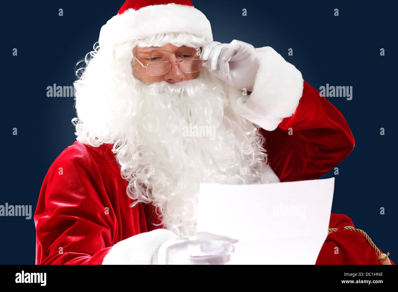 santa claus reading a letter Stock Photo - Alamy