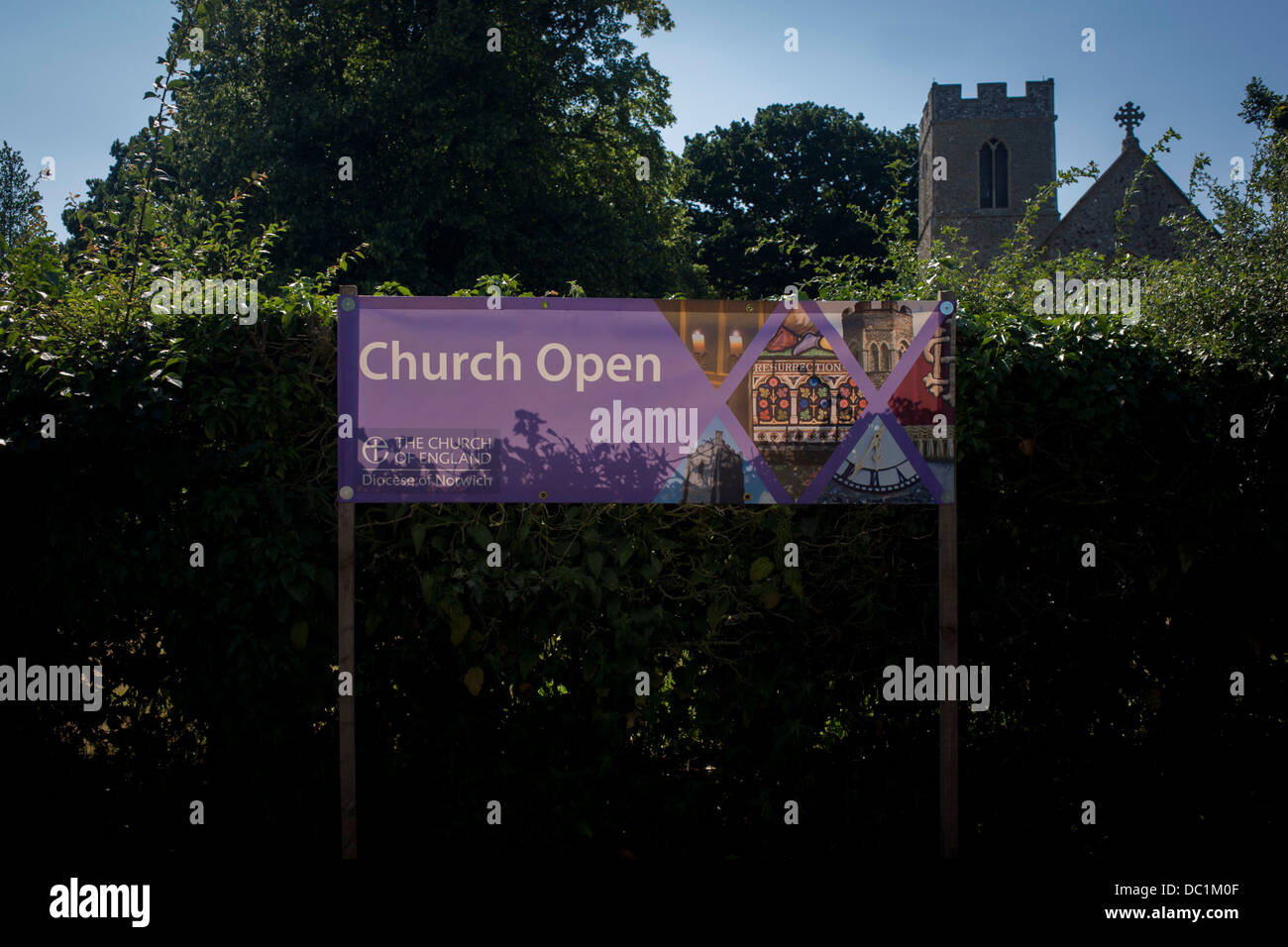Church Open banner on display outside the flint wall architecture of St ...