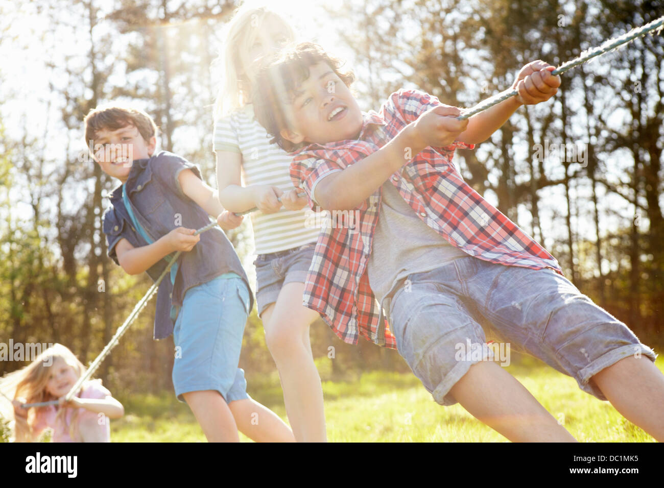 Girl playing tug war hi-res stock photography and images - Alamy