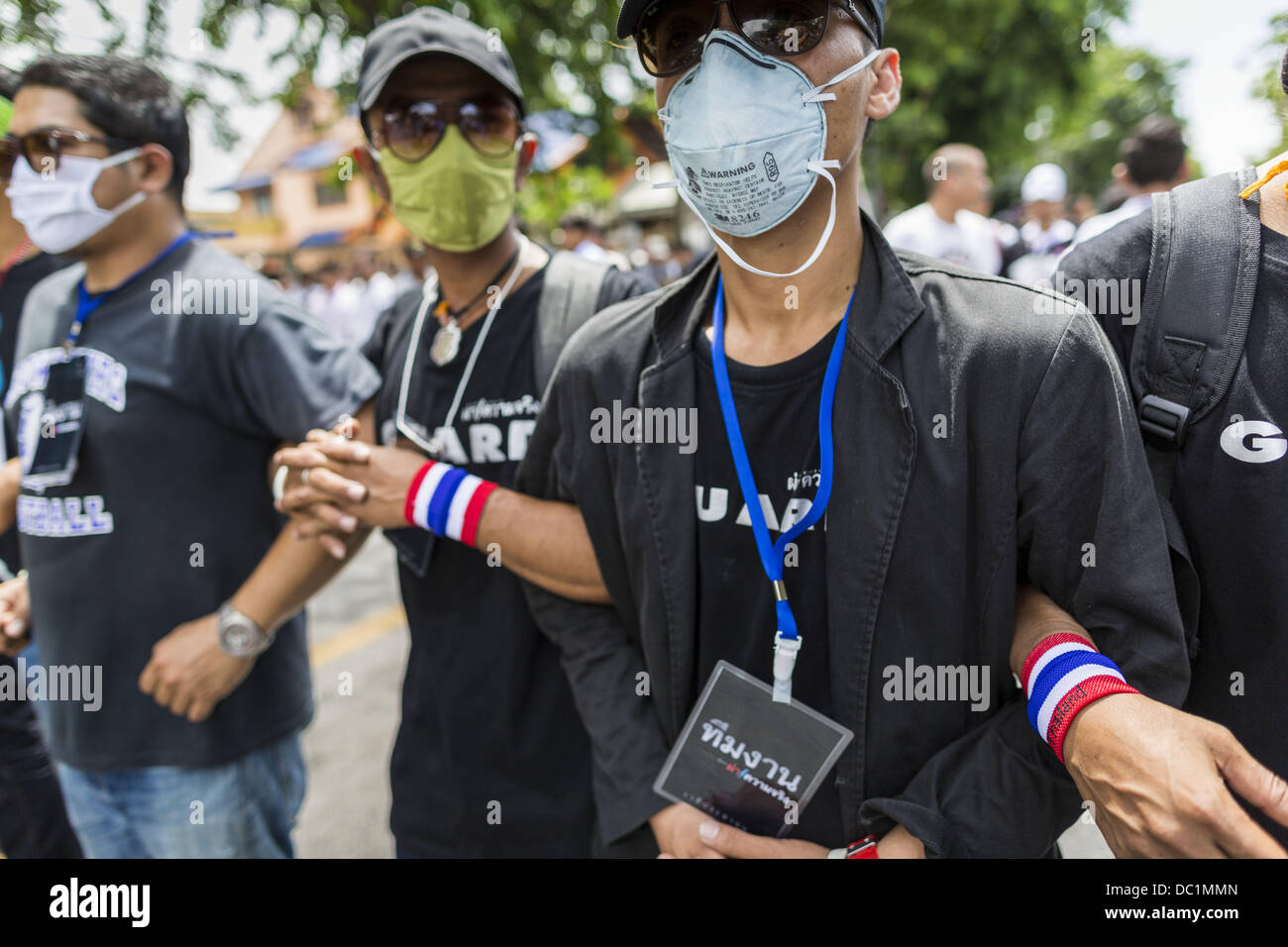 Bangkok, Thailand. 7th Aug, 2013. Anti-amnesty protesters lock arms as ...