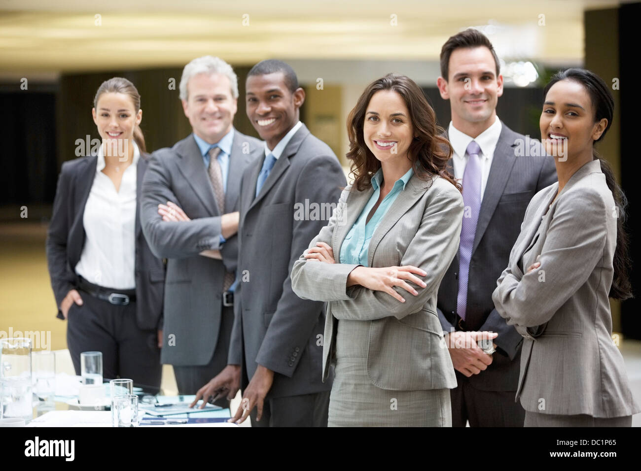 Business people smiling camera arms hi-res stock photography and images ...